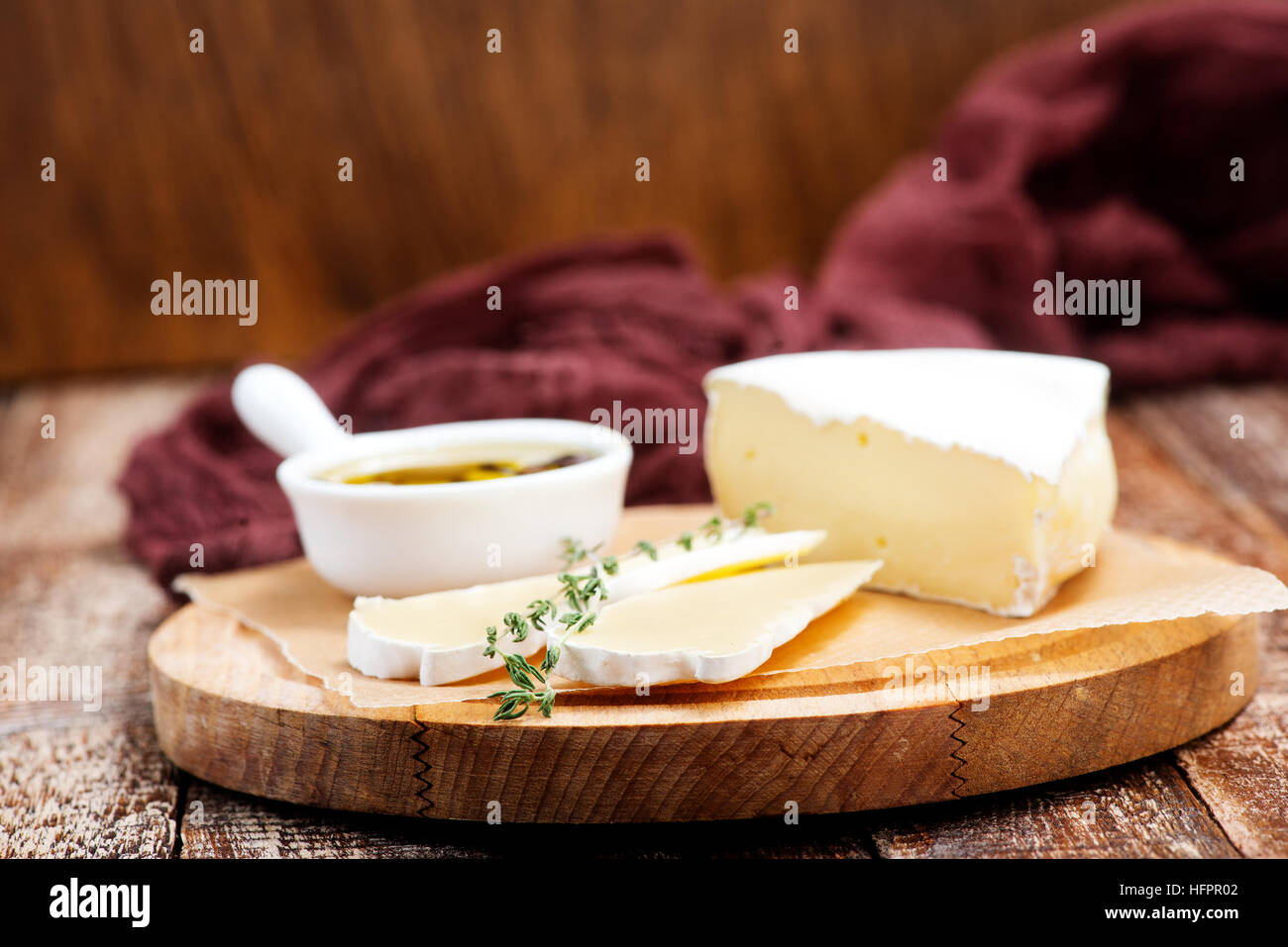 cheese on board and on a table Stock Photo - Alamy