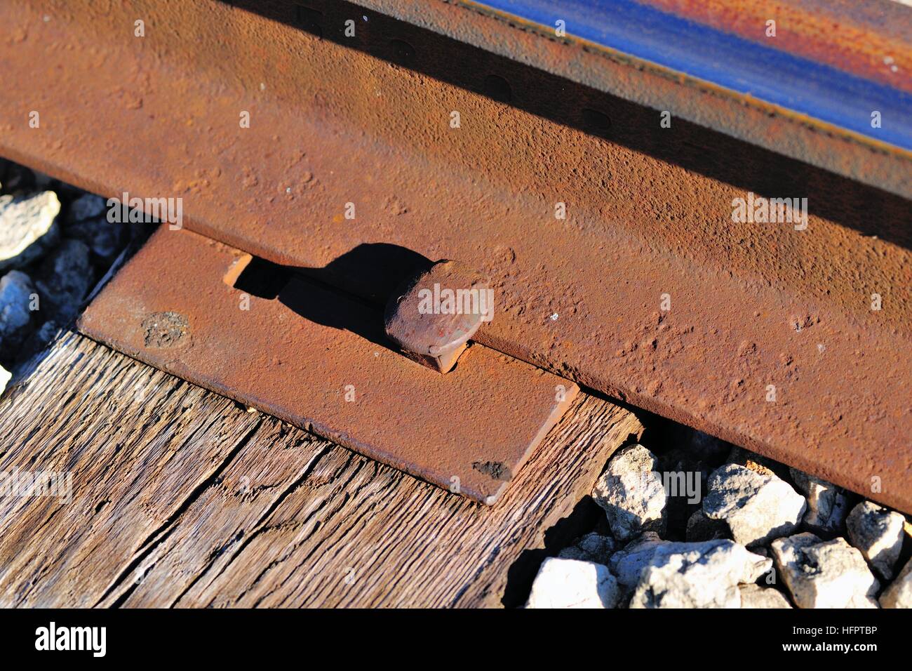 Closeup of a railroad spike, the traditional device used to connect a ...