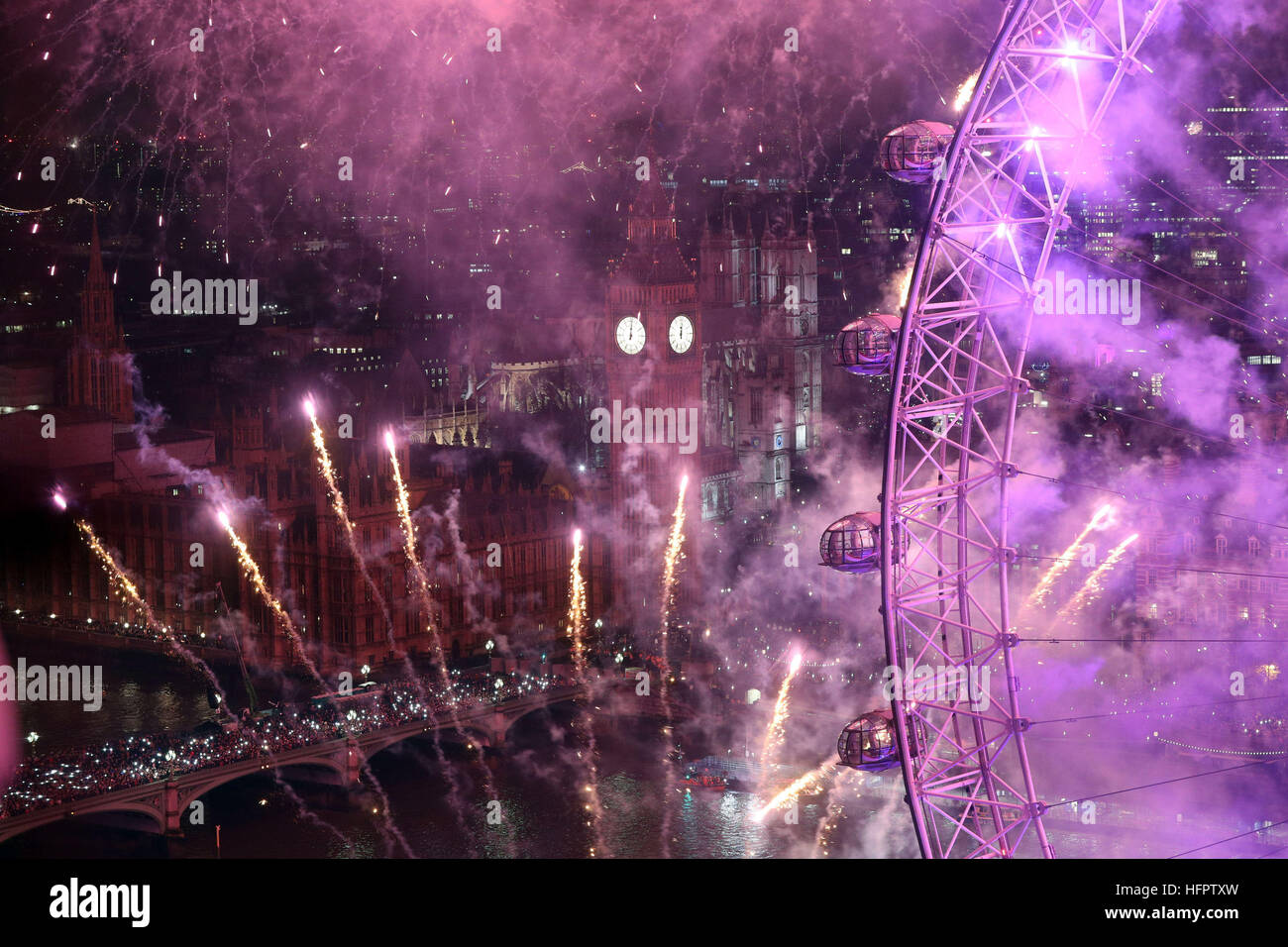 Fireworks light up the sky over the London Eye in central London during ...