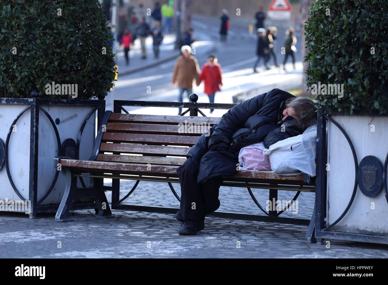 Roma, Italy. 31st Dec, 2016. Homeless on a bench in Via dei Fori ...