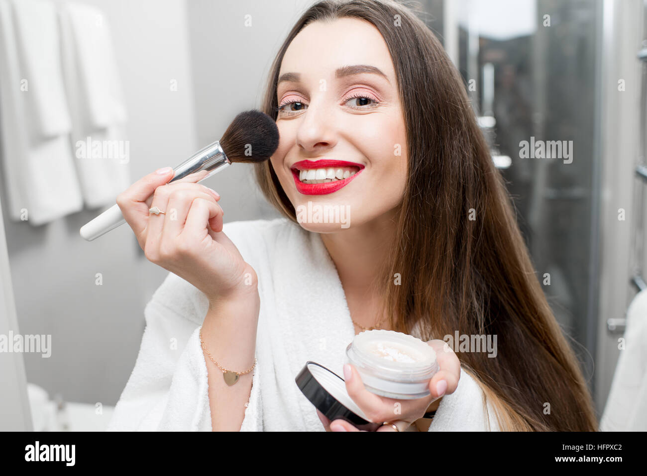 Applying makeup powder hi-res stock photography and images - Alamy