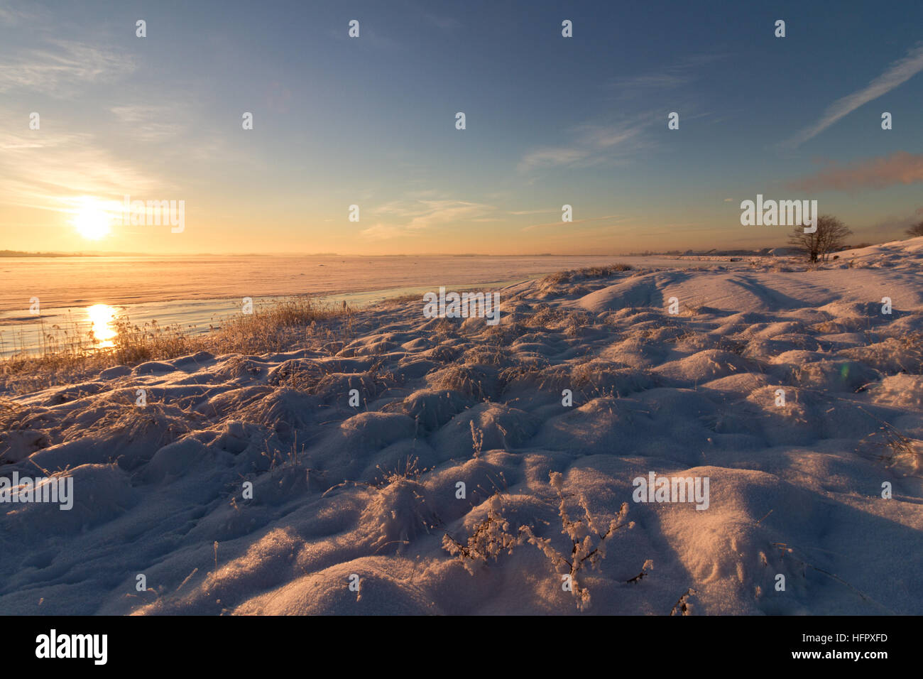 Winter landscape with snow, sea, ocean, ice, blue sky, road with snow ...