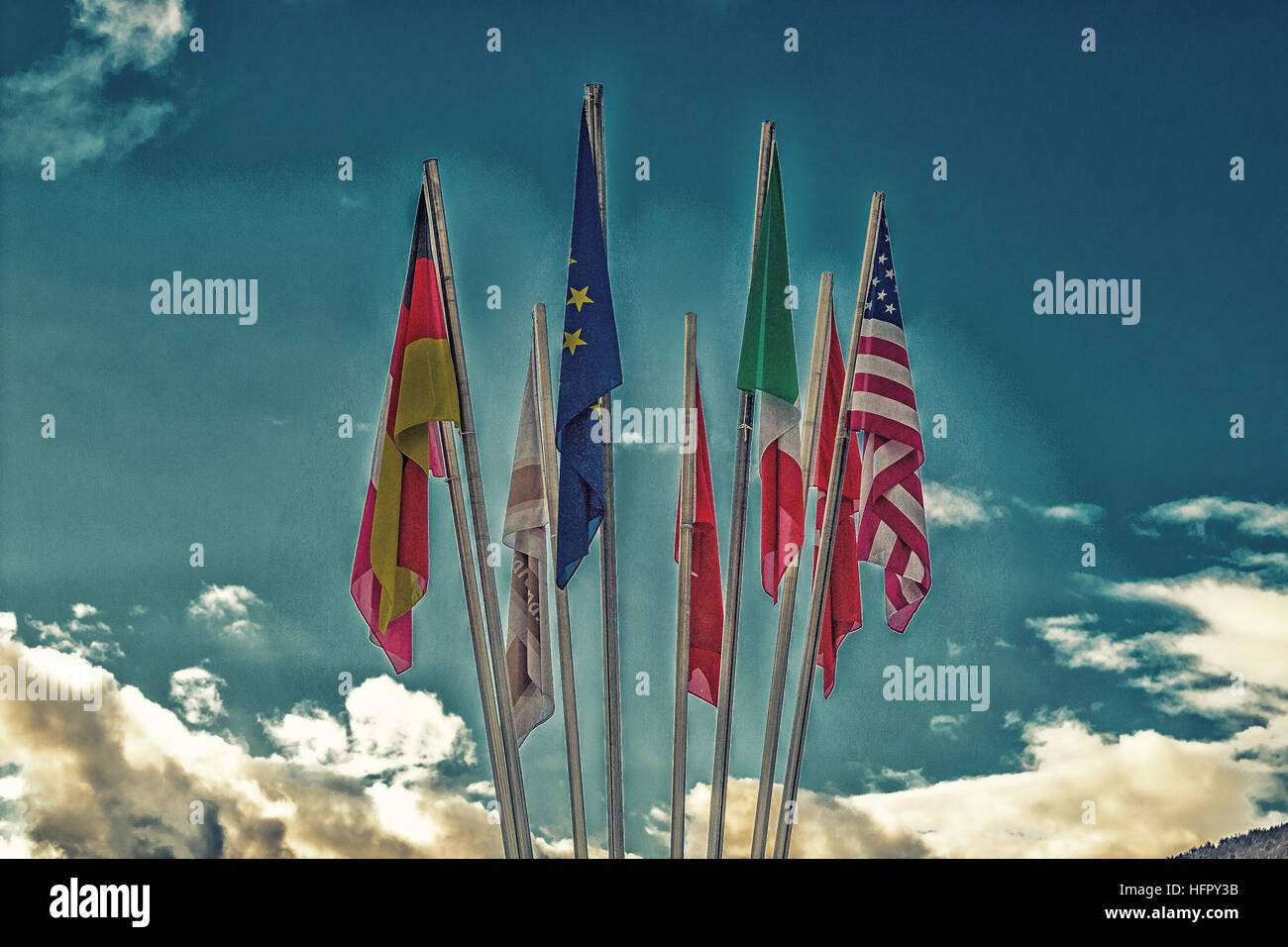some flags of nations hoisted in the sky Stock Photo - Alamy
