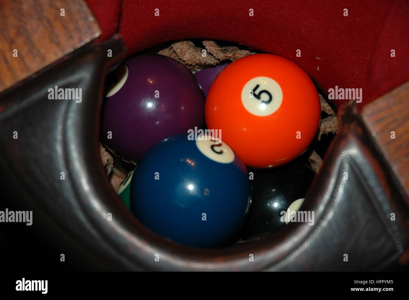 Solid pool balls in the corner pocket Stock Photo - Alamy