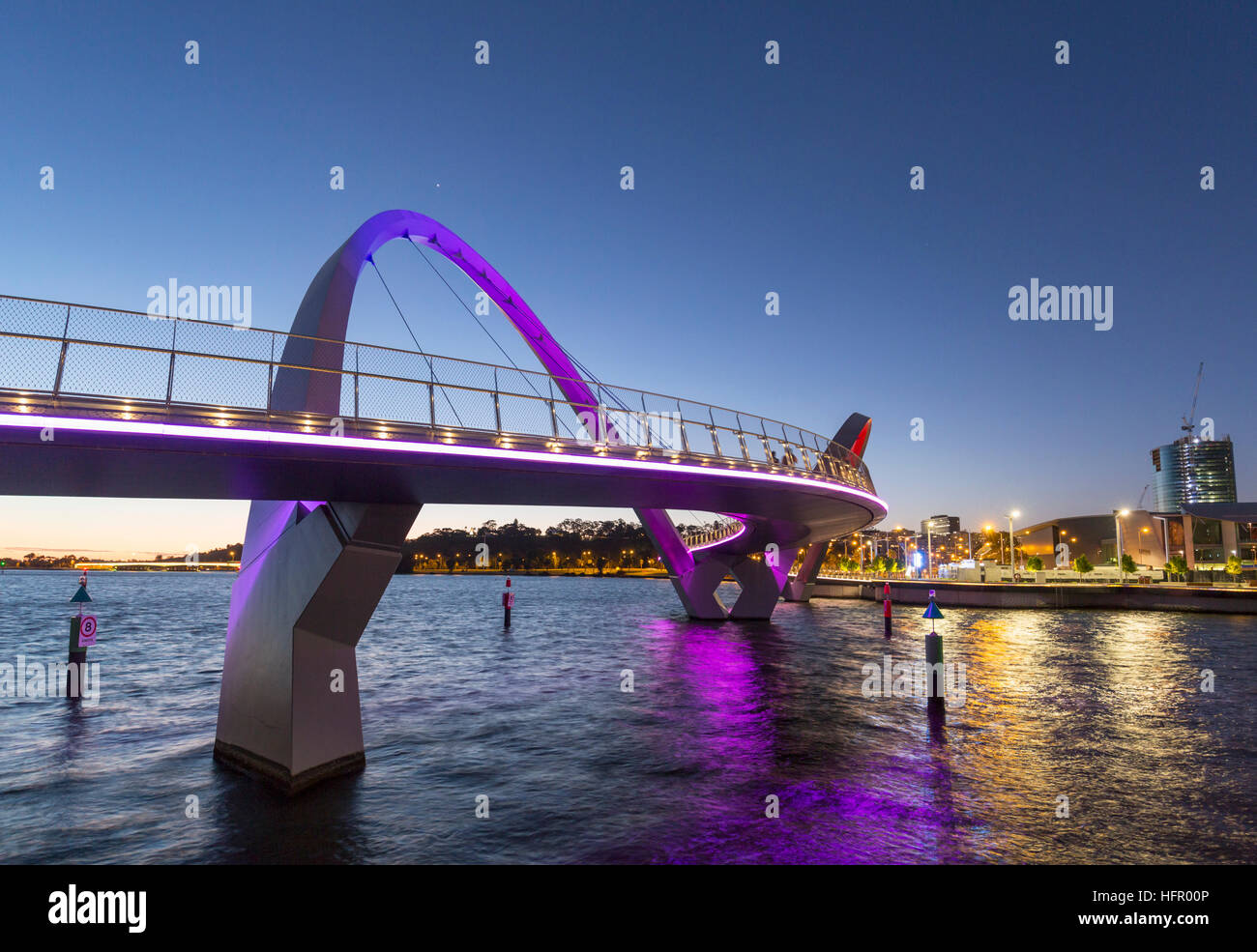 The Elizabeth Quay bridge on the Swan River illuminated at twilight ...