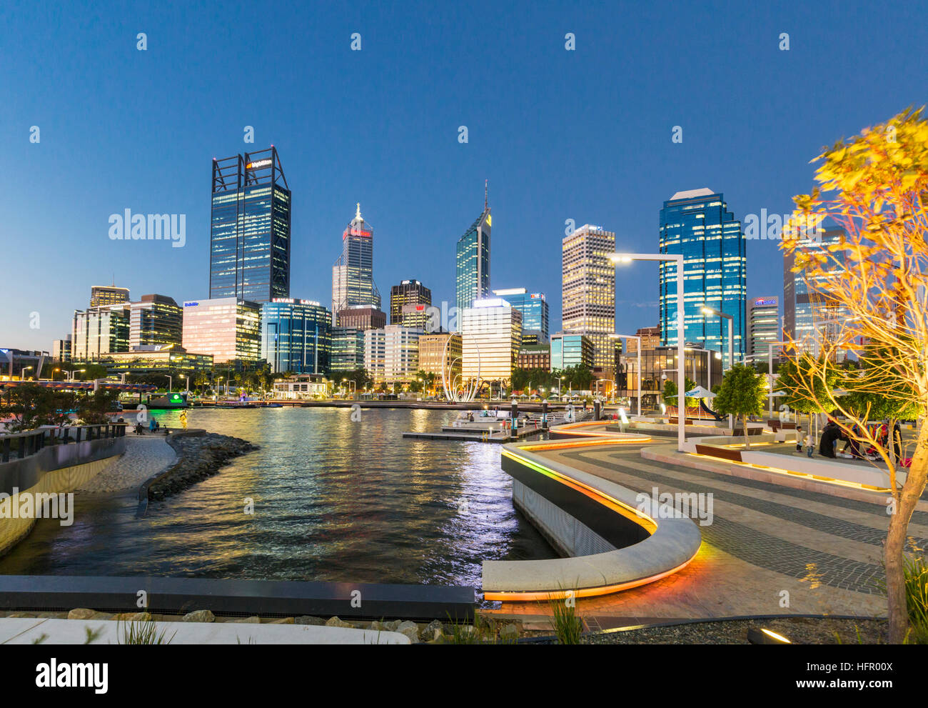 The waterfront precinct of Elizabeth Quay illuminated at twilght with ...