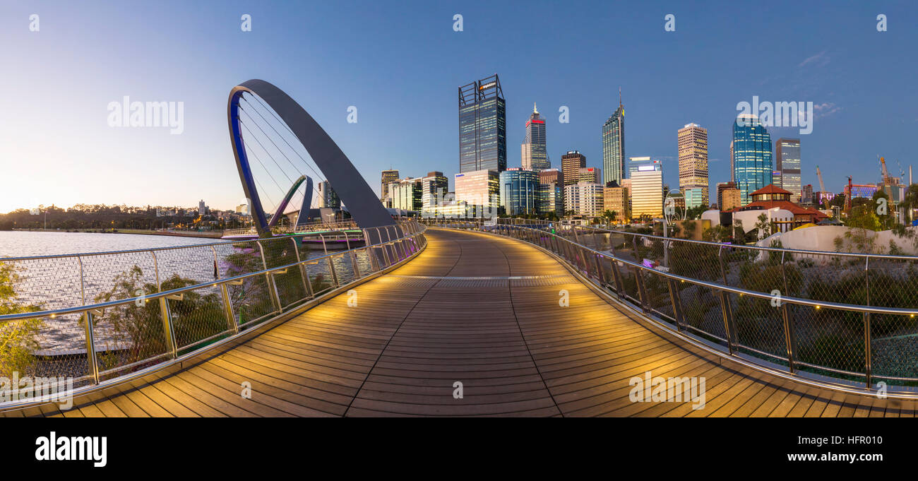 Twilight view along the Elizabeth Quay pedestrian bridge to the city ...