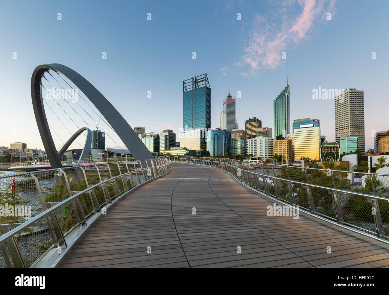 View along the Elizabeth Quay pedestrian bridge to the city skyline at ...