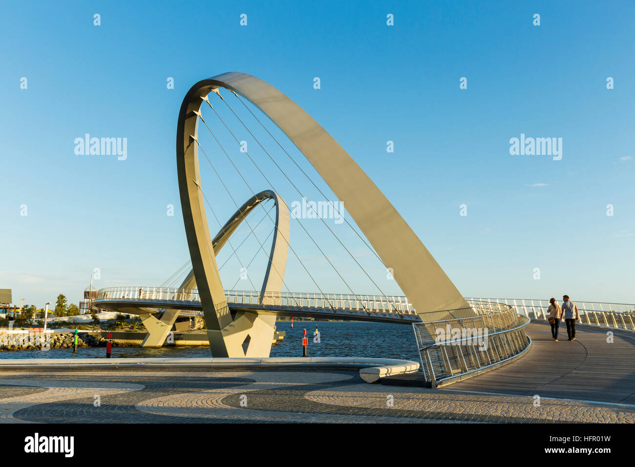 The Elizabeth Quay pedestrian bridge on the Swan River at sunset, Perth ...