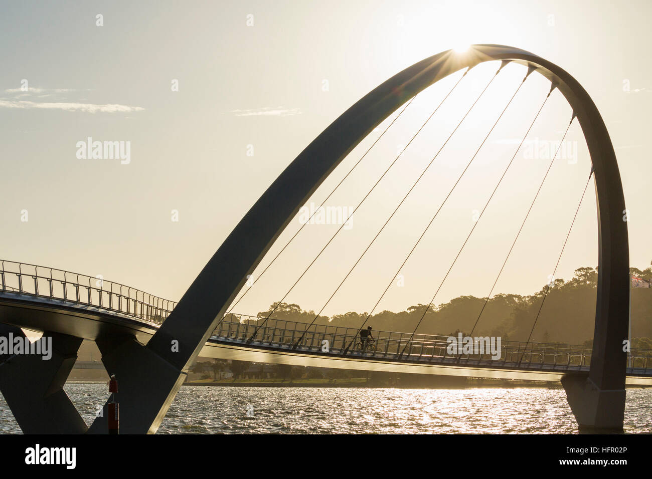 The Elizabeth Quay pedestrian bridge on the Swan River at sunset, Perth ...