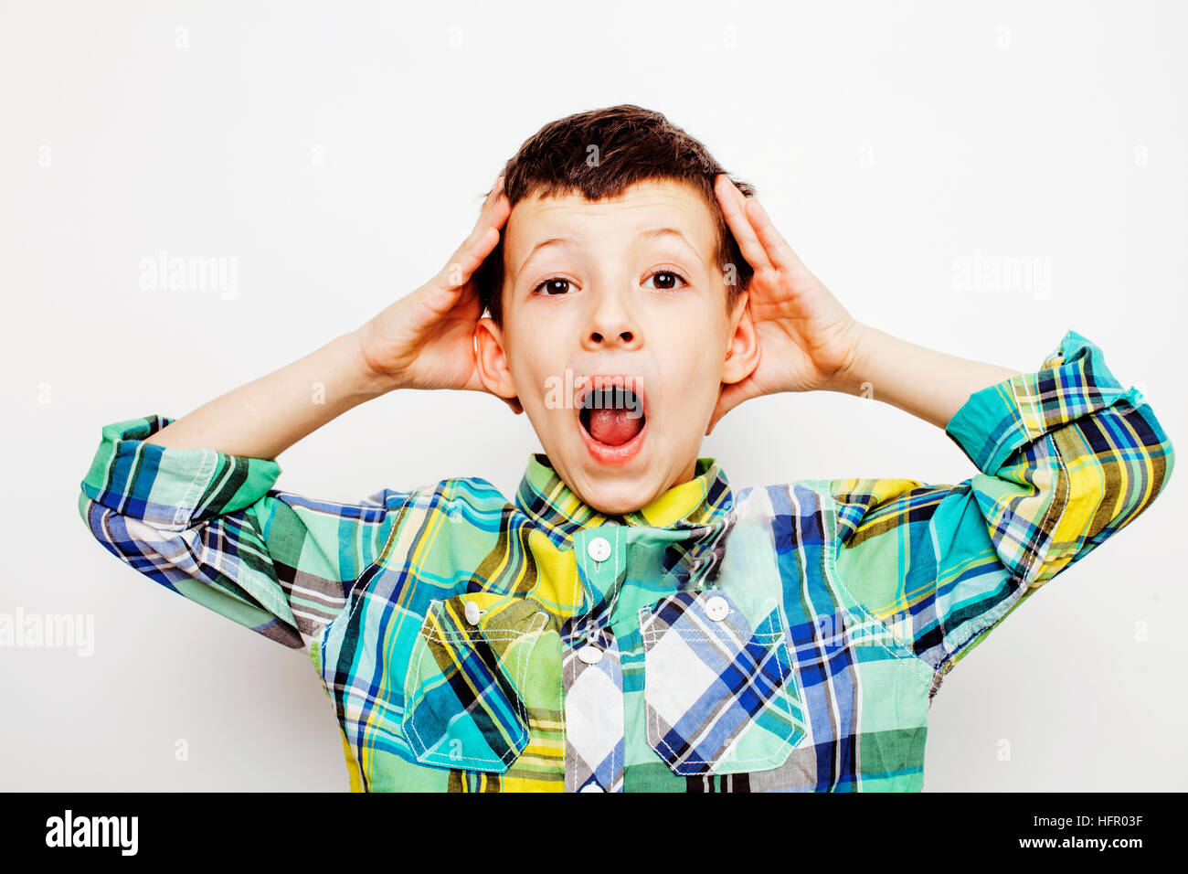 young pretty little boy kid wondering, posing emotional face isolated ...