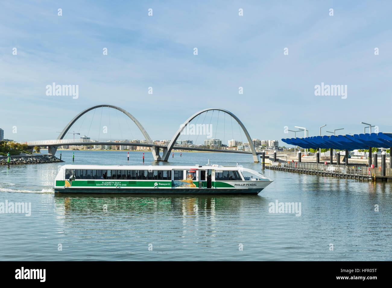 A Swan River ferry arriving at Elizabeth Quay ferry terminal with ...