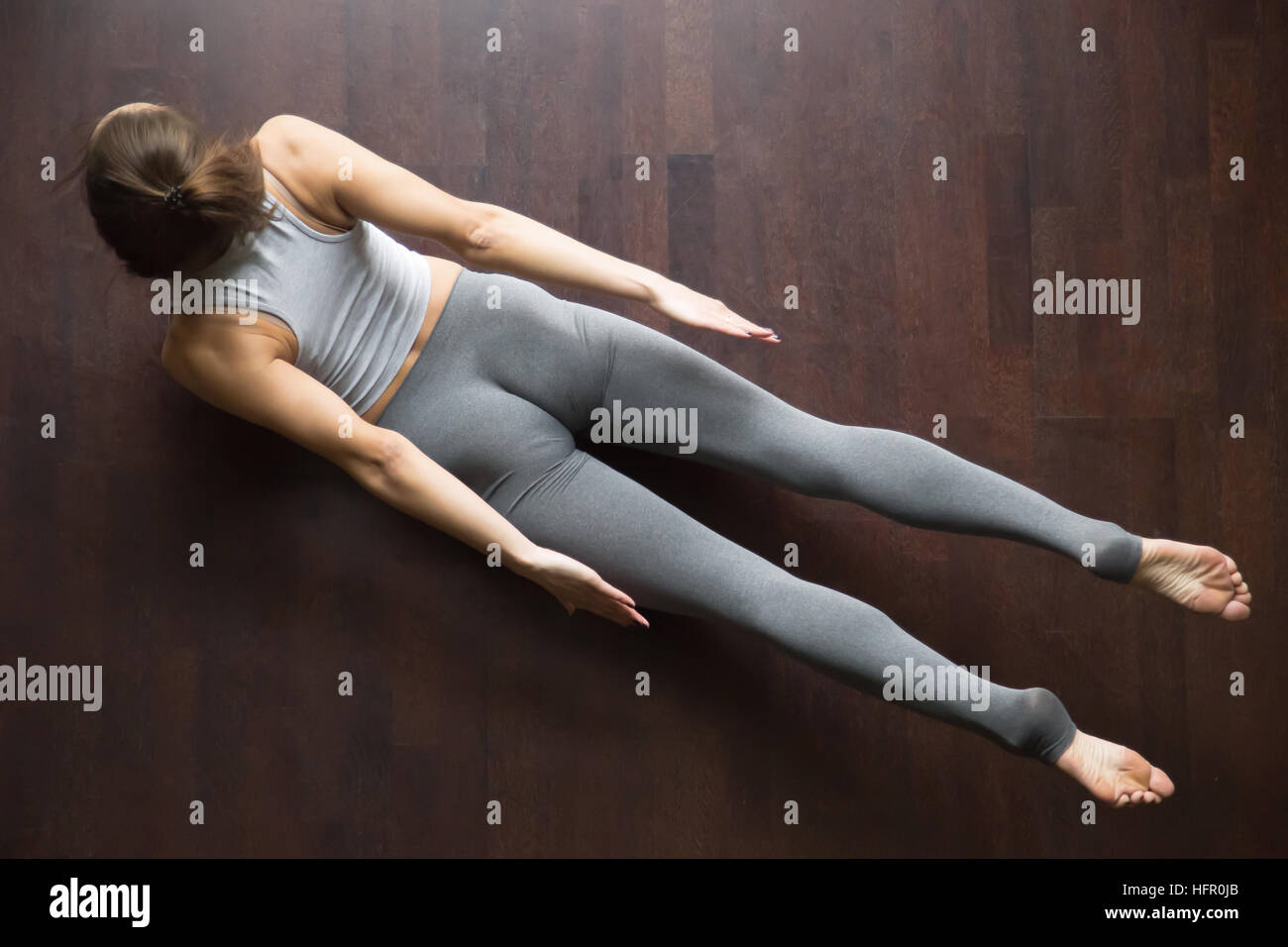 View from above of Salabhasana yoga Pose Stock Photo - Alamy