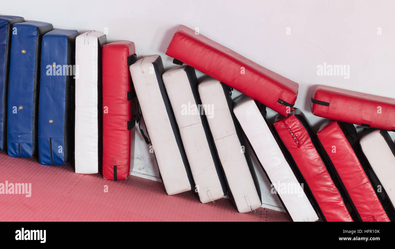 Large punching pads in a row, red white and blue Stock Photo - Alamy