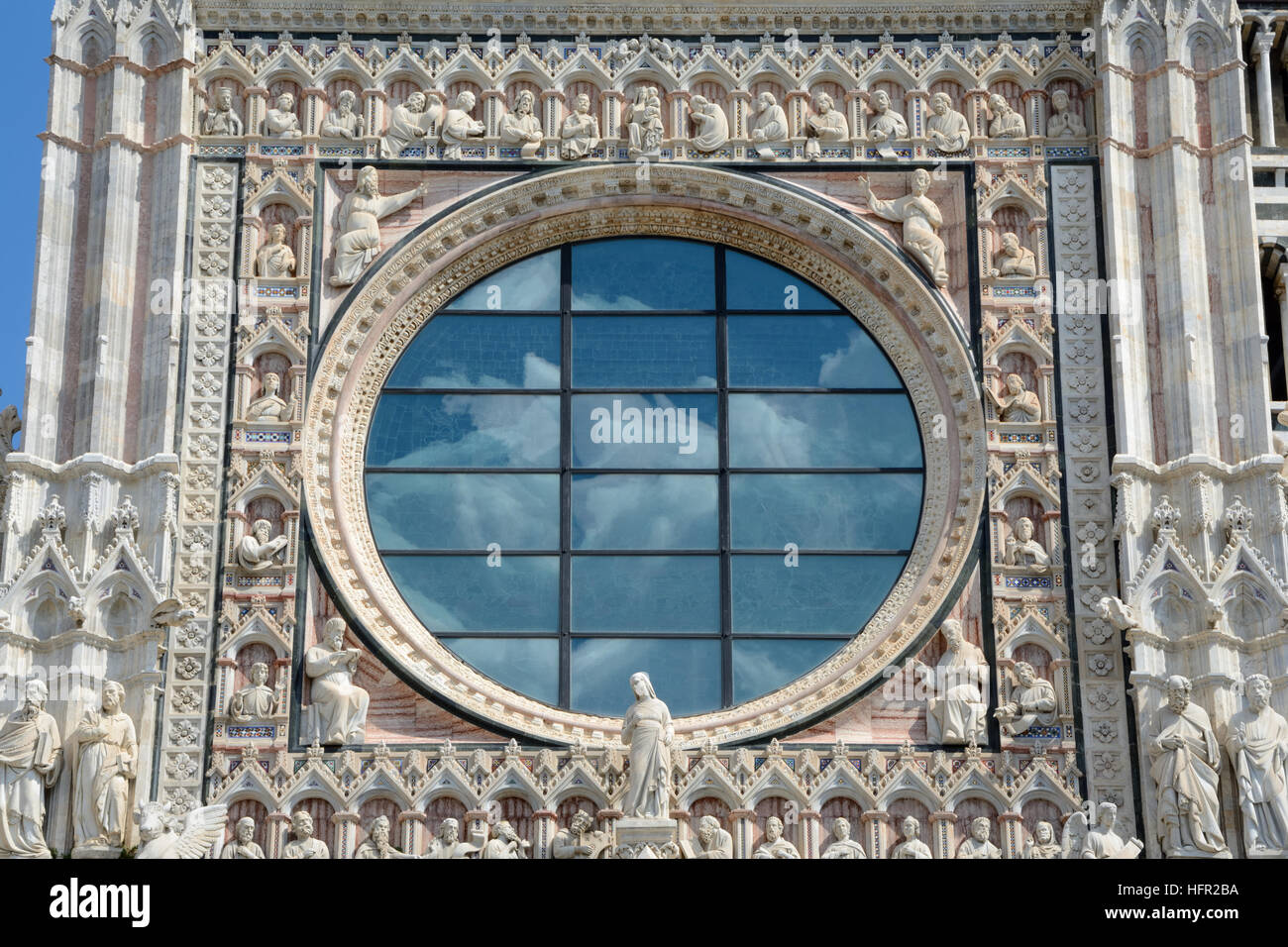Siena, Italy - September 8, 2016: Round stained glass window of ...
