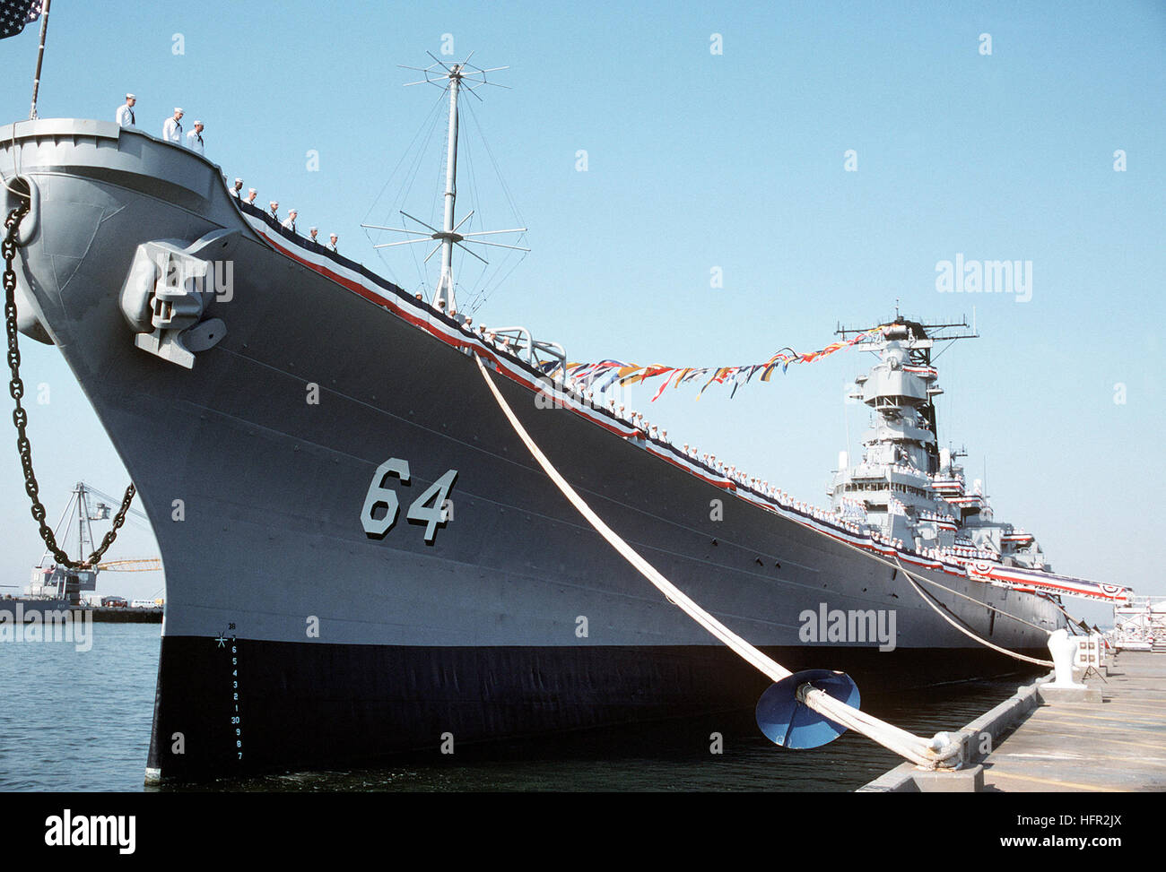 Crew members man the rails aboard the battleship USS WISCONSIN (BB-64 ...