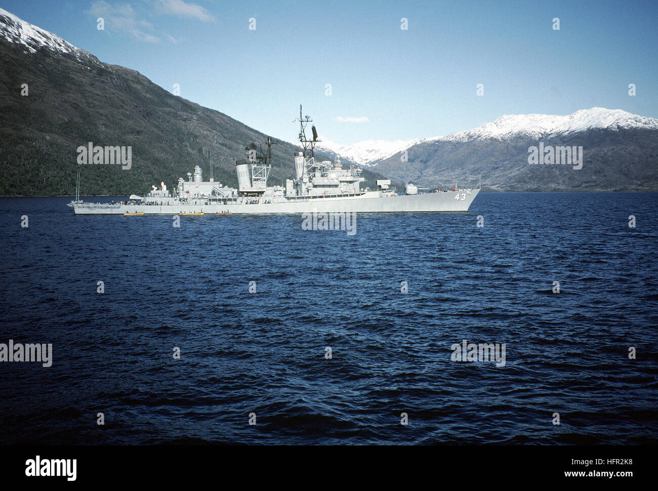 Small boats come alongside the guided missile destroyer USS DAHLGREN ...