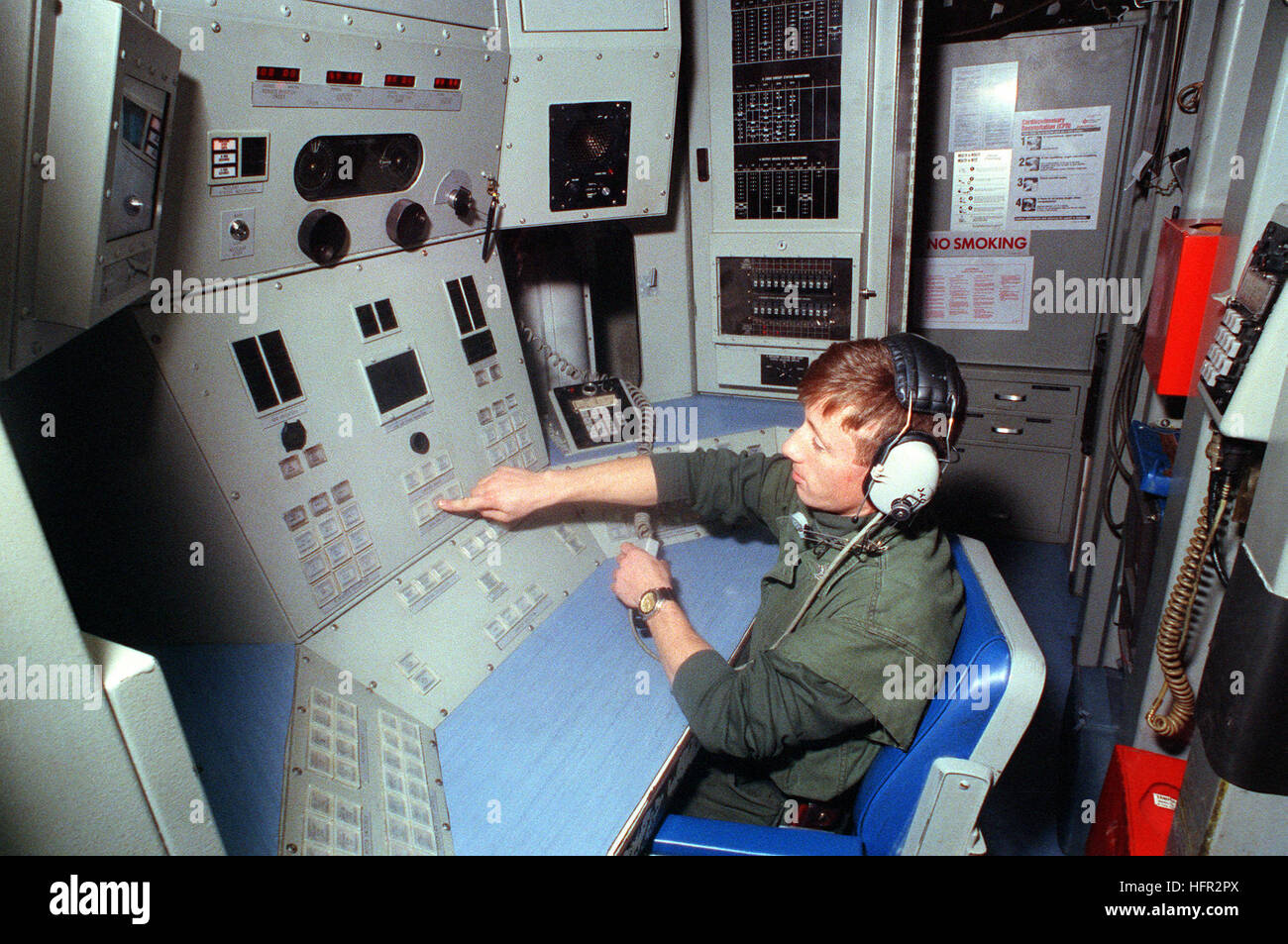Gunner's Mate (Missiles) 2nd Class Scott Purcell works the control ...