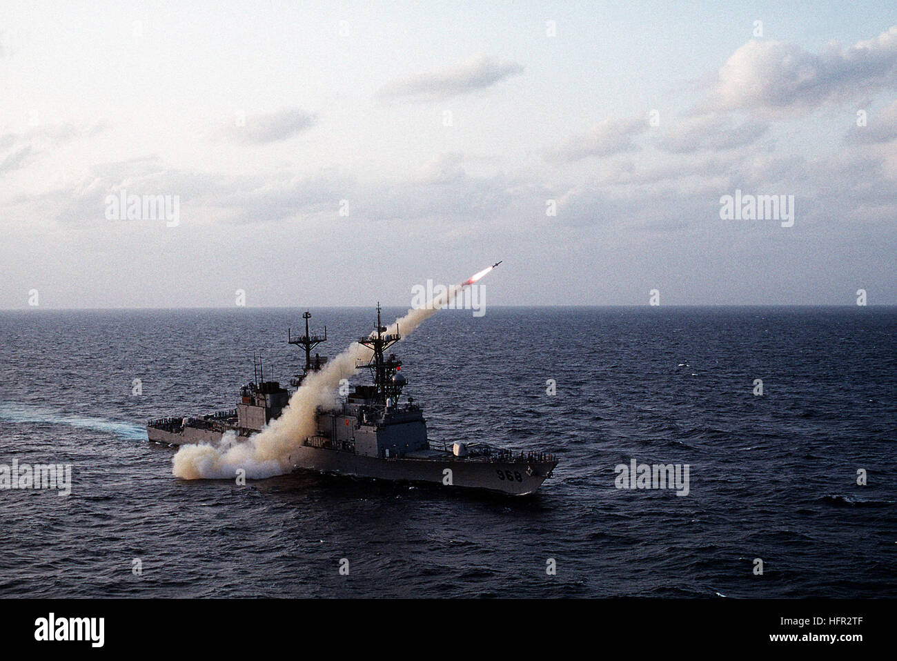 The destroyer USS ARTHUR W. RADFORD (DD-968) fires a Harpoon missile ...