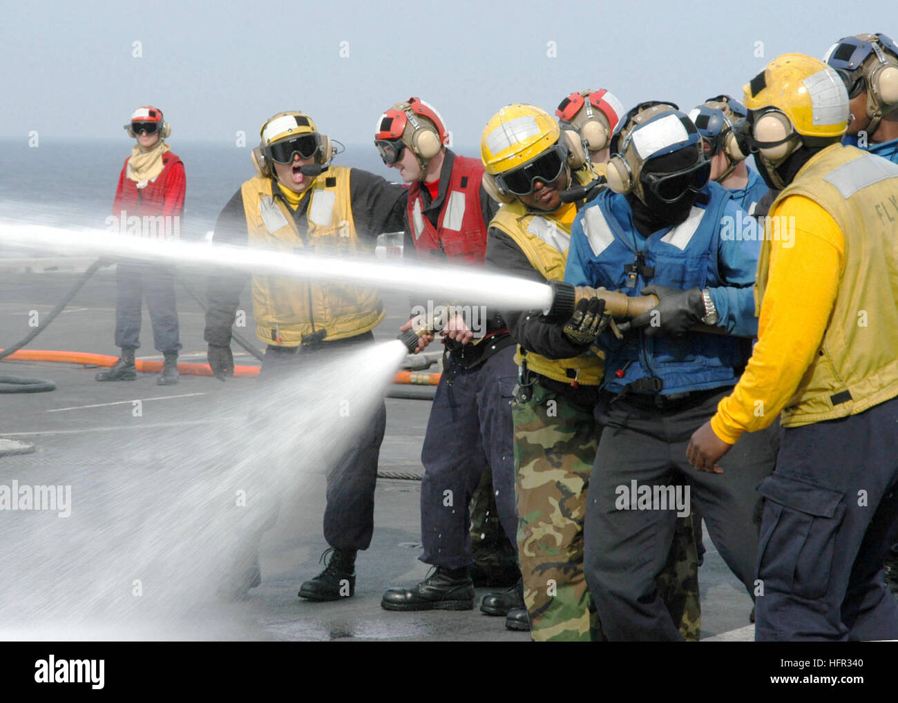 Flight deck directors instruct Sailors from the Air Department in ...