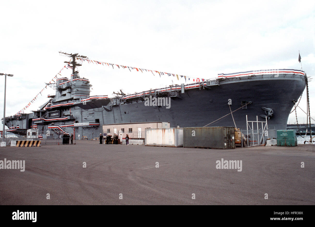 The amphibious assault ship USS Okinawa (LPH-3) is moored to a pier ...