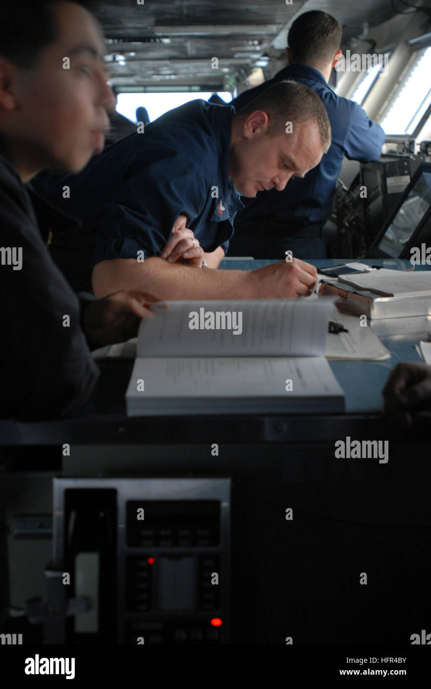 080917-N-4995K-040 GULF OF OMAN (Sept.17, 2008) A Sailor stands plotter ...