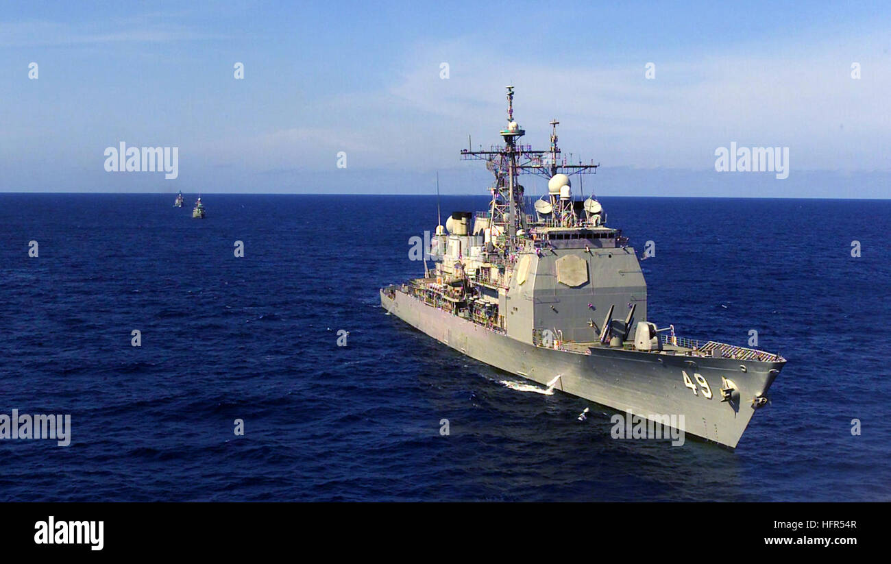 The guided missile cruiser USS Vincennes (CG 49) conducts joint ...