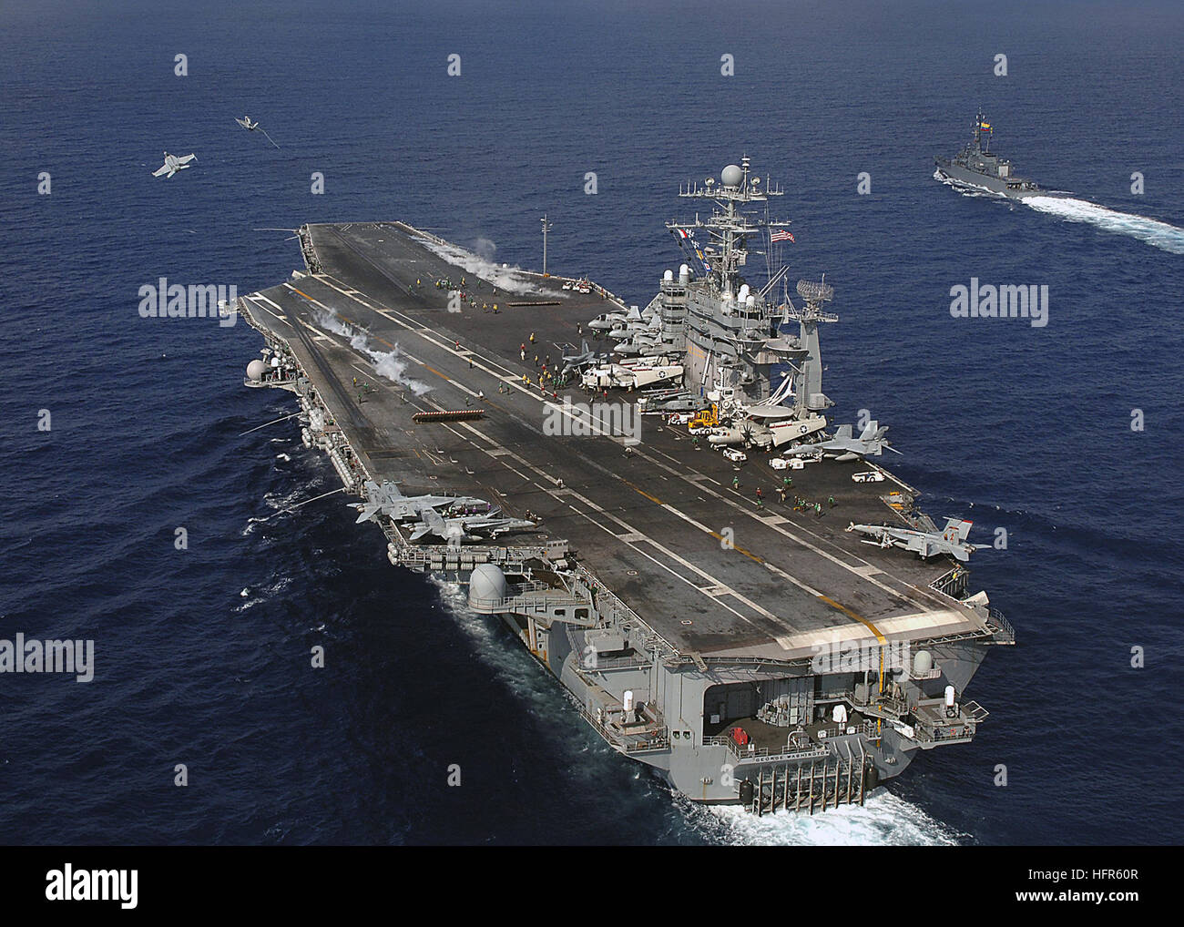 ARC Caldas (FM 52) stands plane guard while two F/A-18 Super Hornets ...