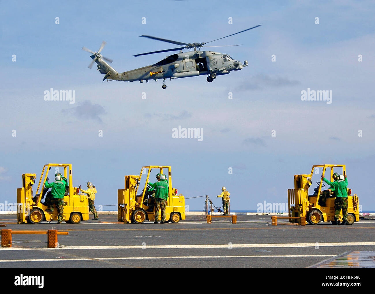 A SH-60B Seahawk from HSL-47 lands aboard USS Abraham Lincoln (CVN 72 ...