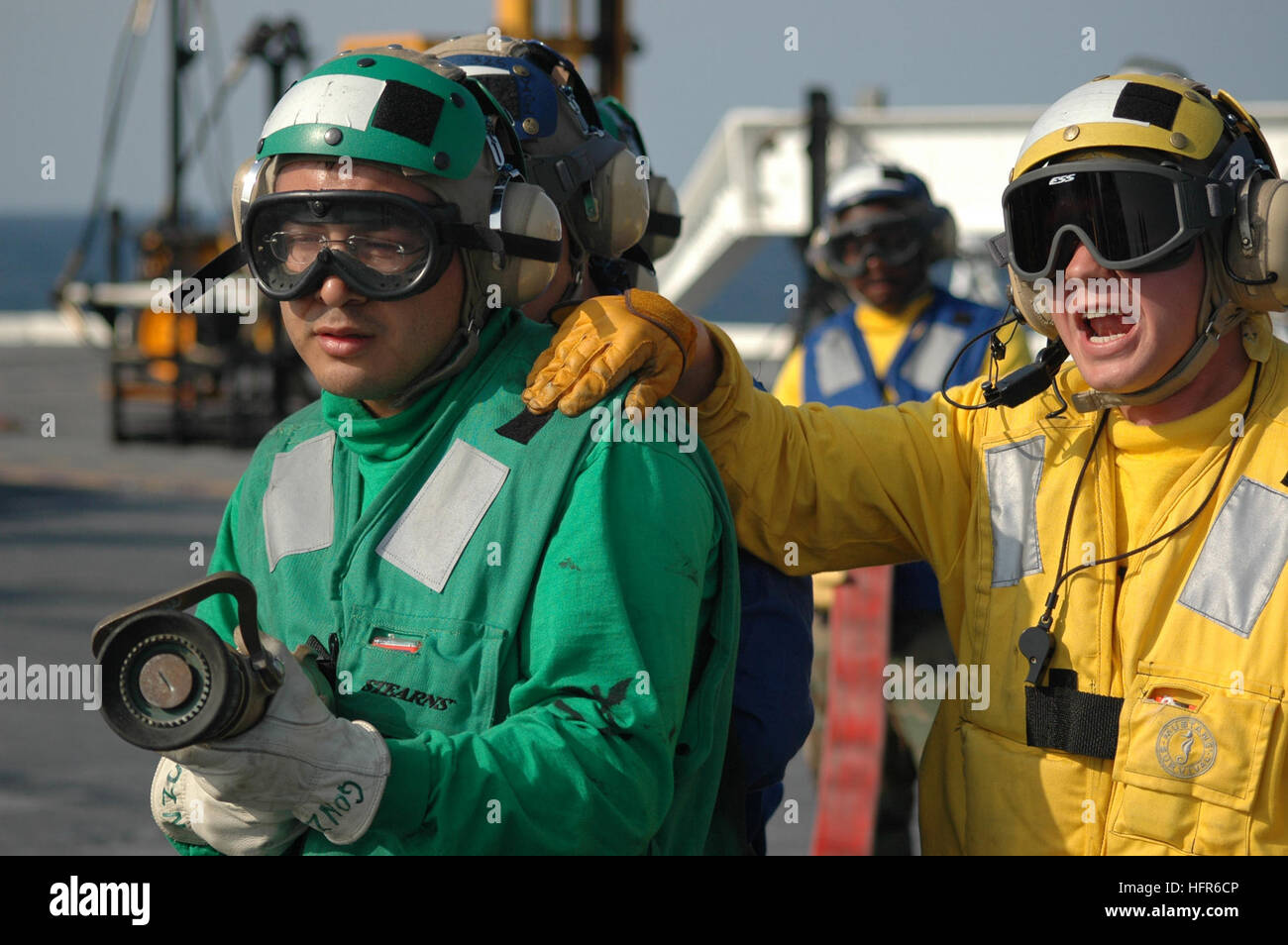 Air department personnel conduct a firefighting drill on USS Kitty Hawk ...