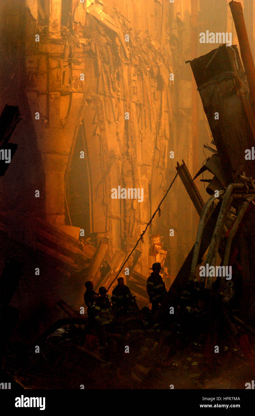 Rescue workers conduct search and rescue operations within the rubble ...