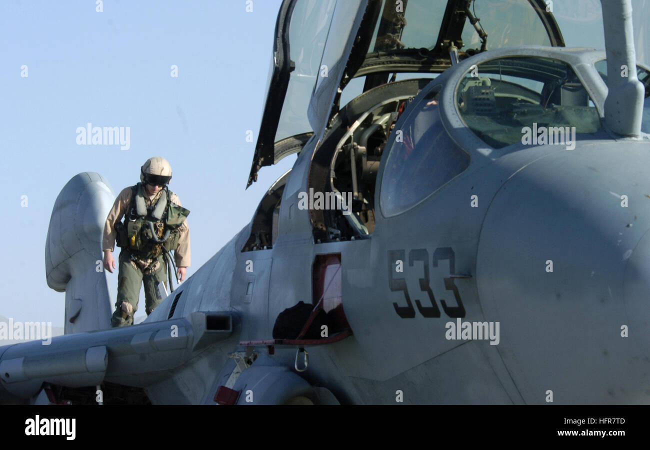 Air Force Captain Matthew Polus walks a Navy EA-6B Prowler, checking it ...