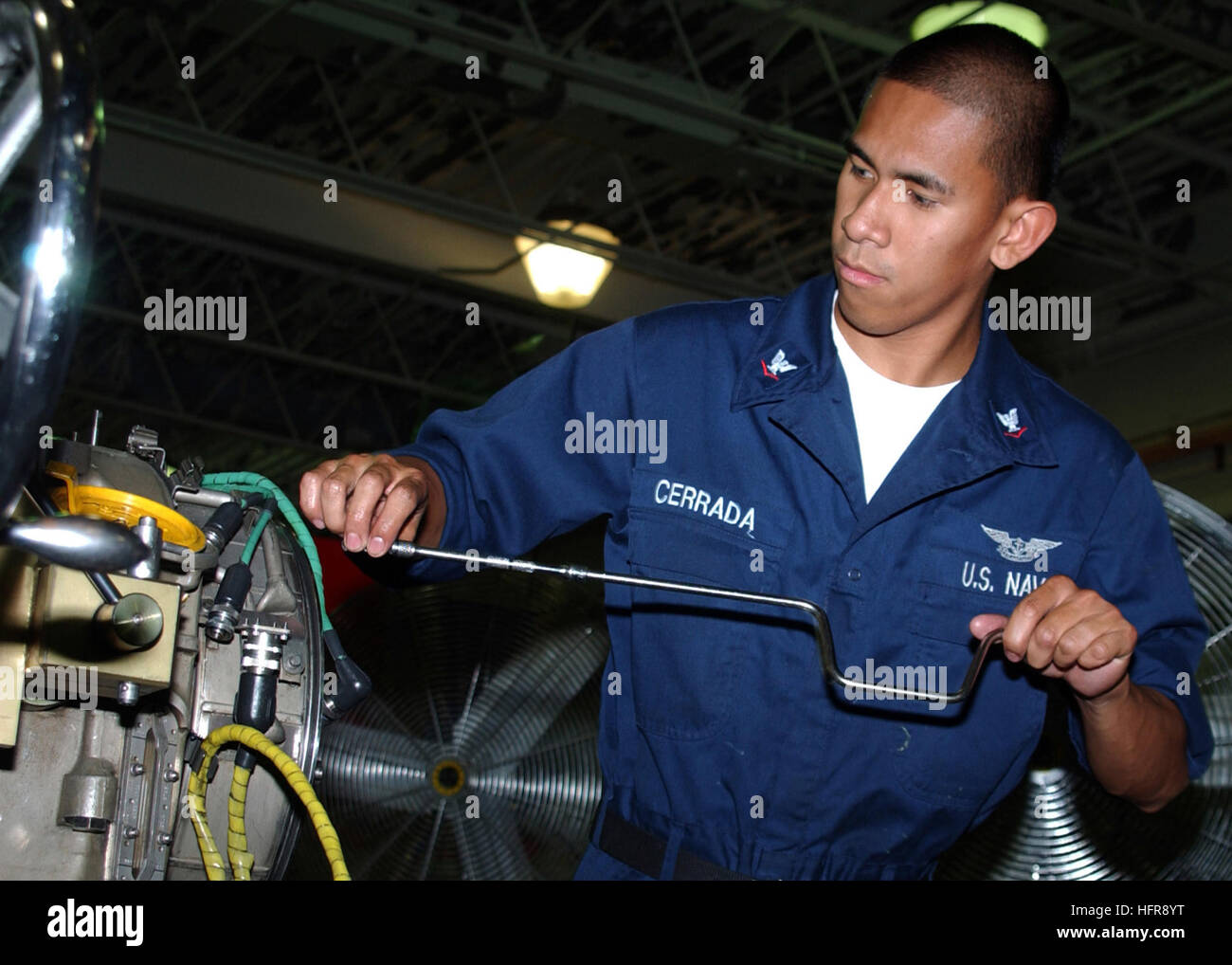 An SH-60B Seahawk helicopter engine is disassembled, inspected, and ...