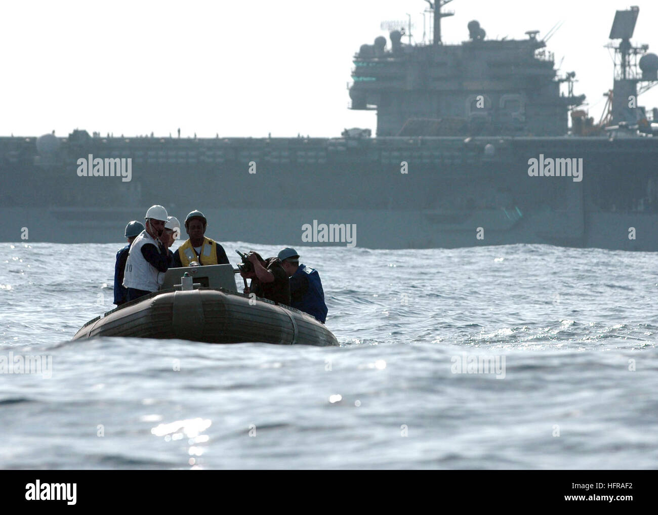 Sailors aboard USS Kitty Hawk (CV 63) conduct man-overboard training ...
