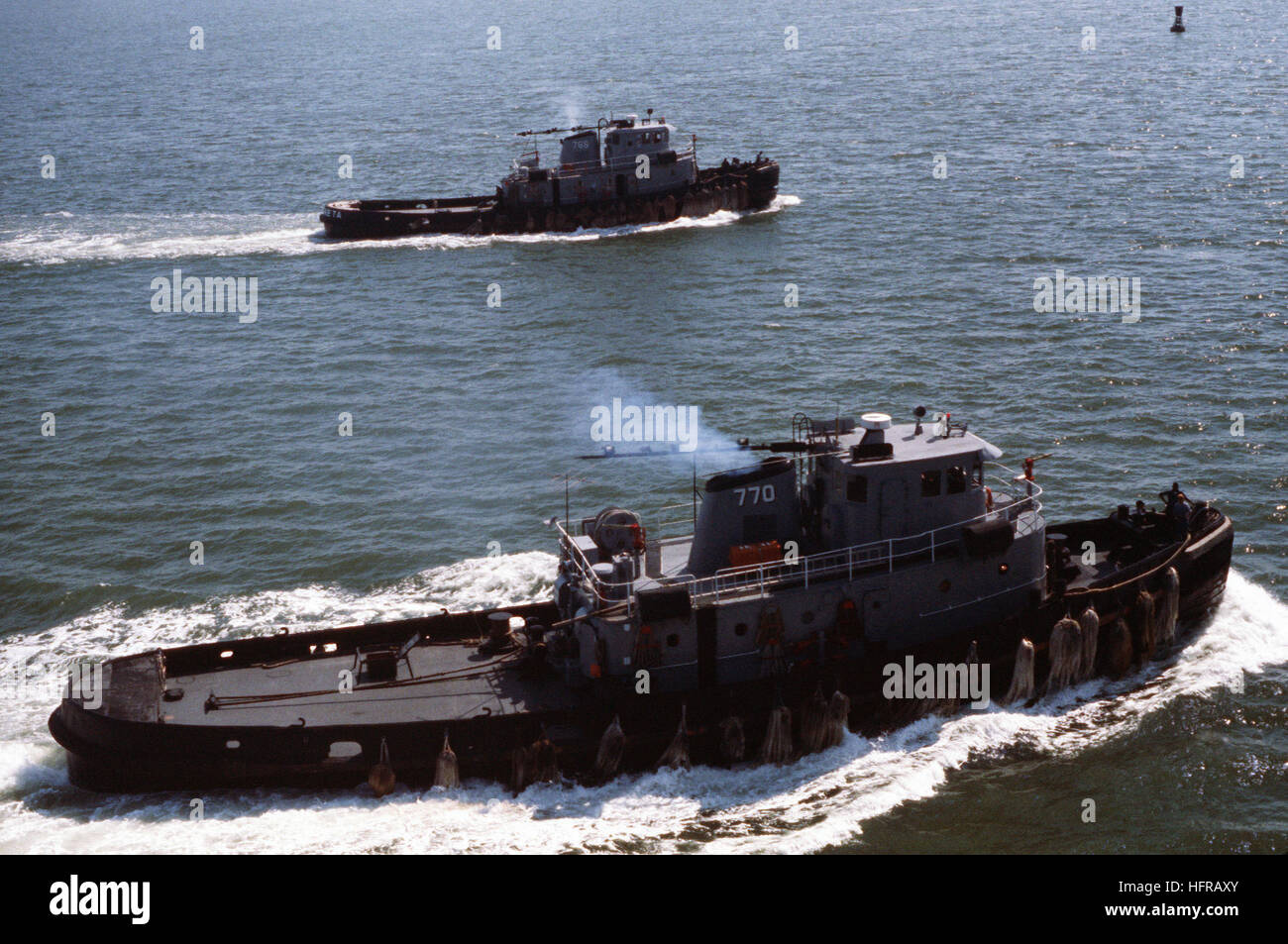 Starboard view of harbor tugs USS Wapakoneta (YTB 766) and USS ...