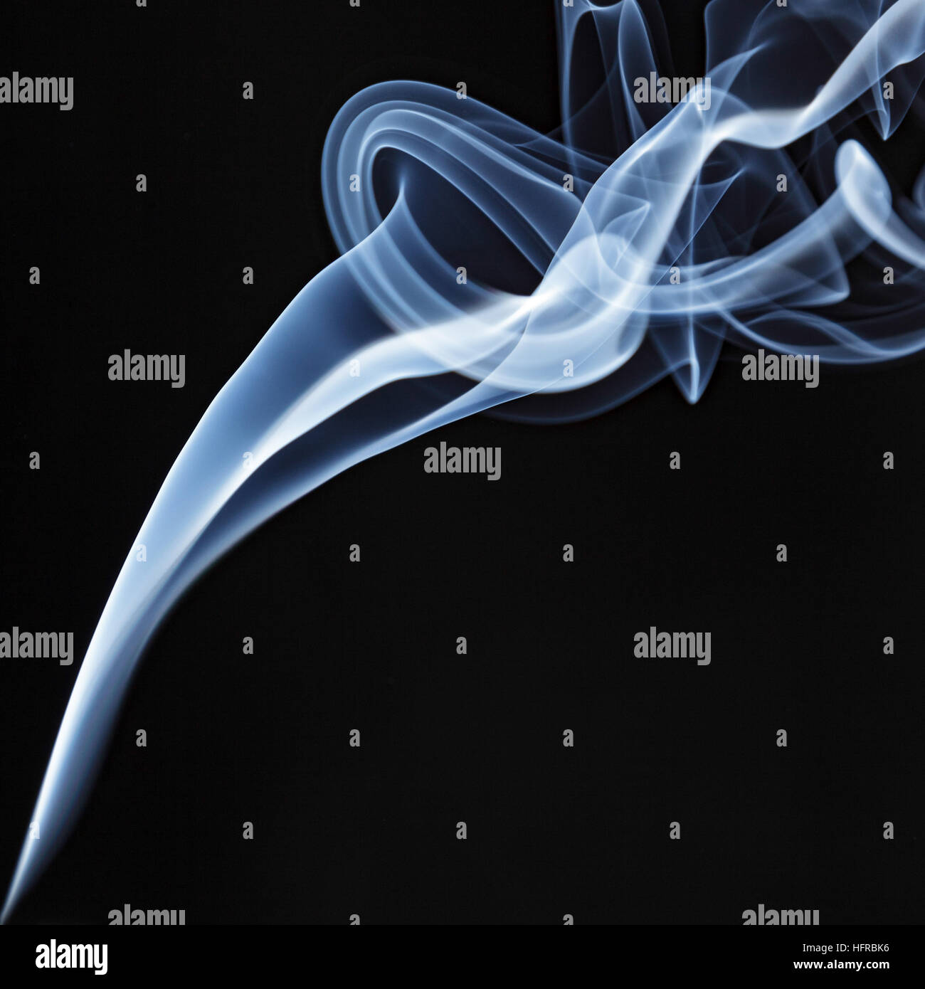 Incense Stick Smoke Trail against a Black Background Stock Photo - Alamy