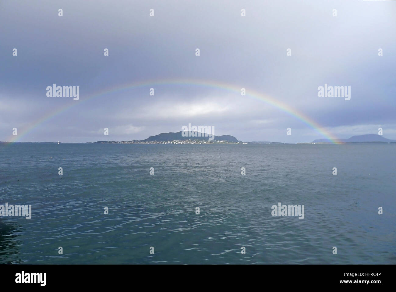 Colorful rainbow over an island Norway Stock Photo - Alamy