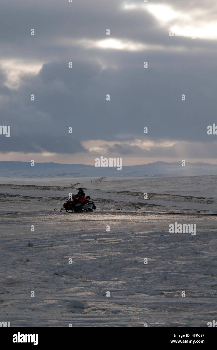 snow scooter driving on ice Northcape Norway Stock Photo - Alamy