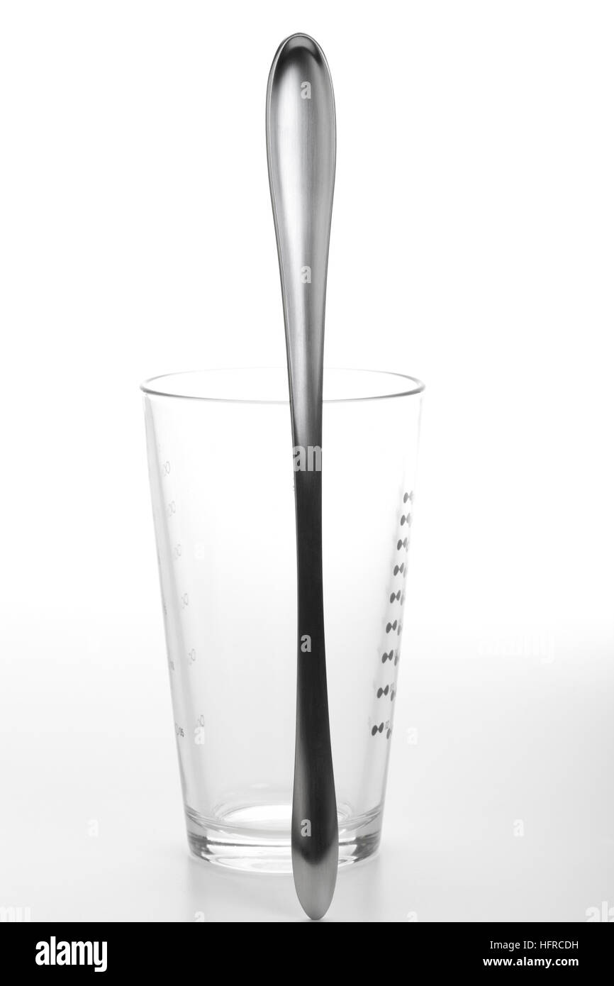 Stirring spoon in a measuring cup Stock Photo - Alamy