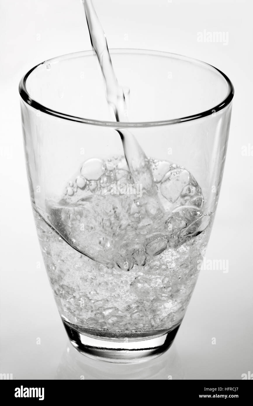 Water being poured into a glass Stock Photo - Alamy