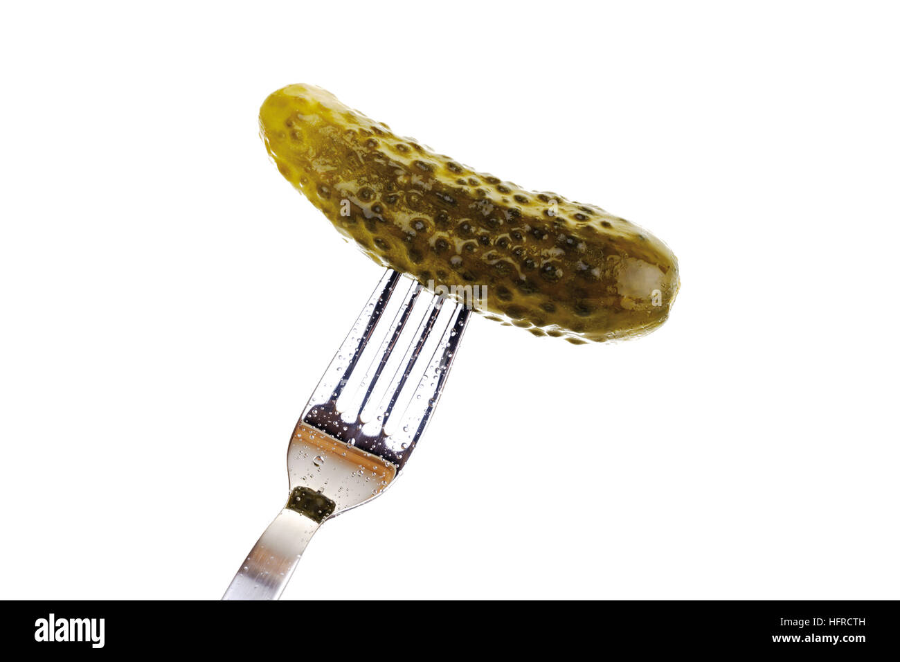 Fork holding a pickle Stock Photo - Alamy