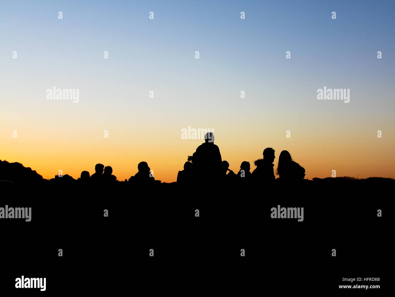 People silhouette against sunset Stock Photo - Alamy