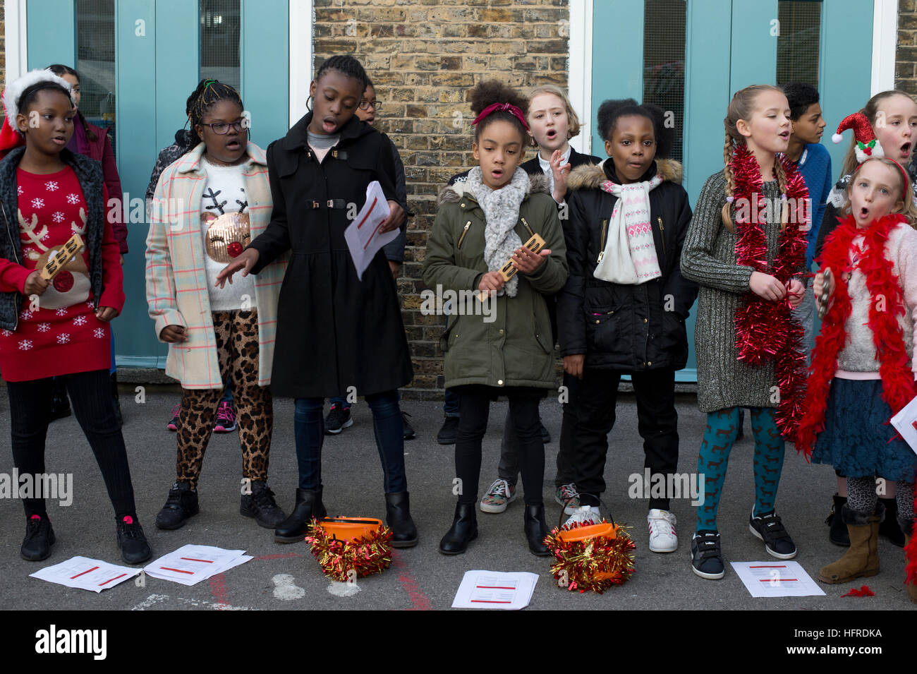 Hackney. Young carol singers raising money for charity Stock Photo - Alamy