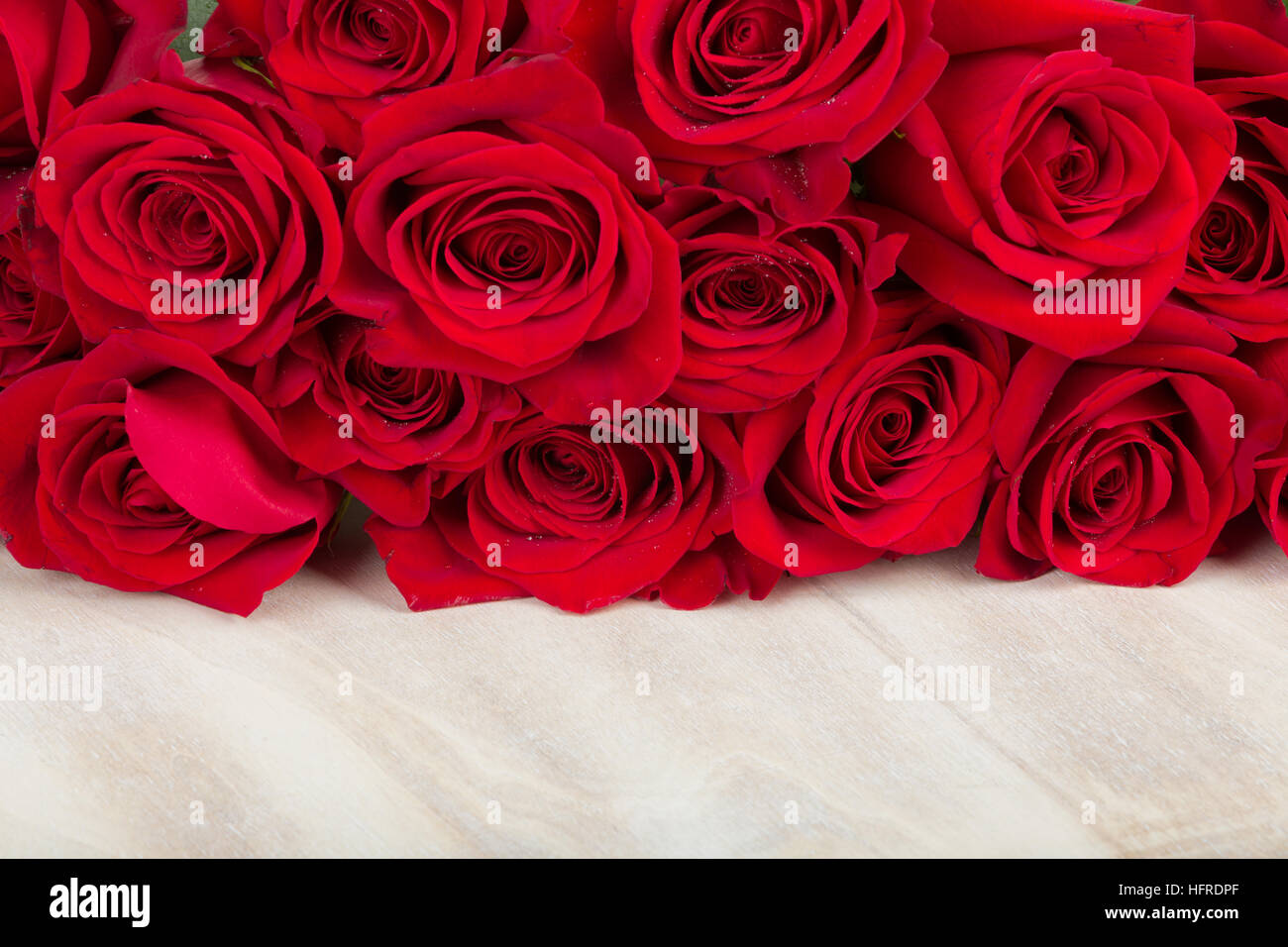 Valentine gift with bouquet of fresh red roses and space for text. Love ...