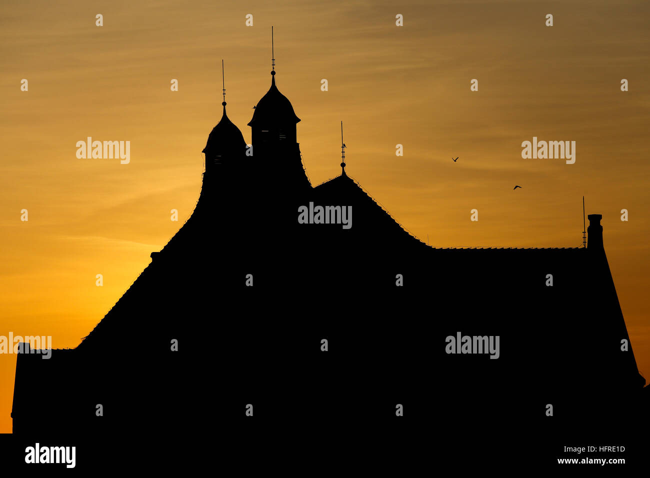 Building with towers at sunset Stock Photo - Alamy