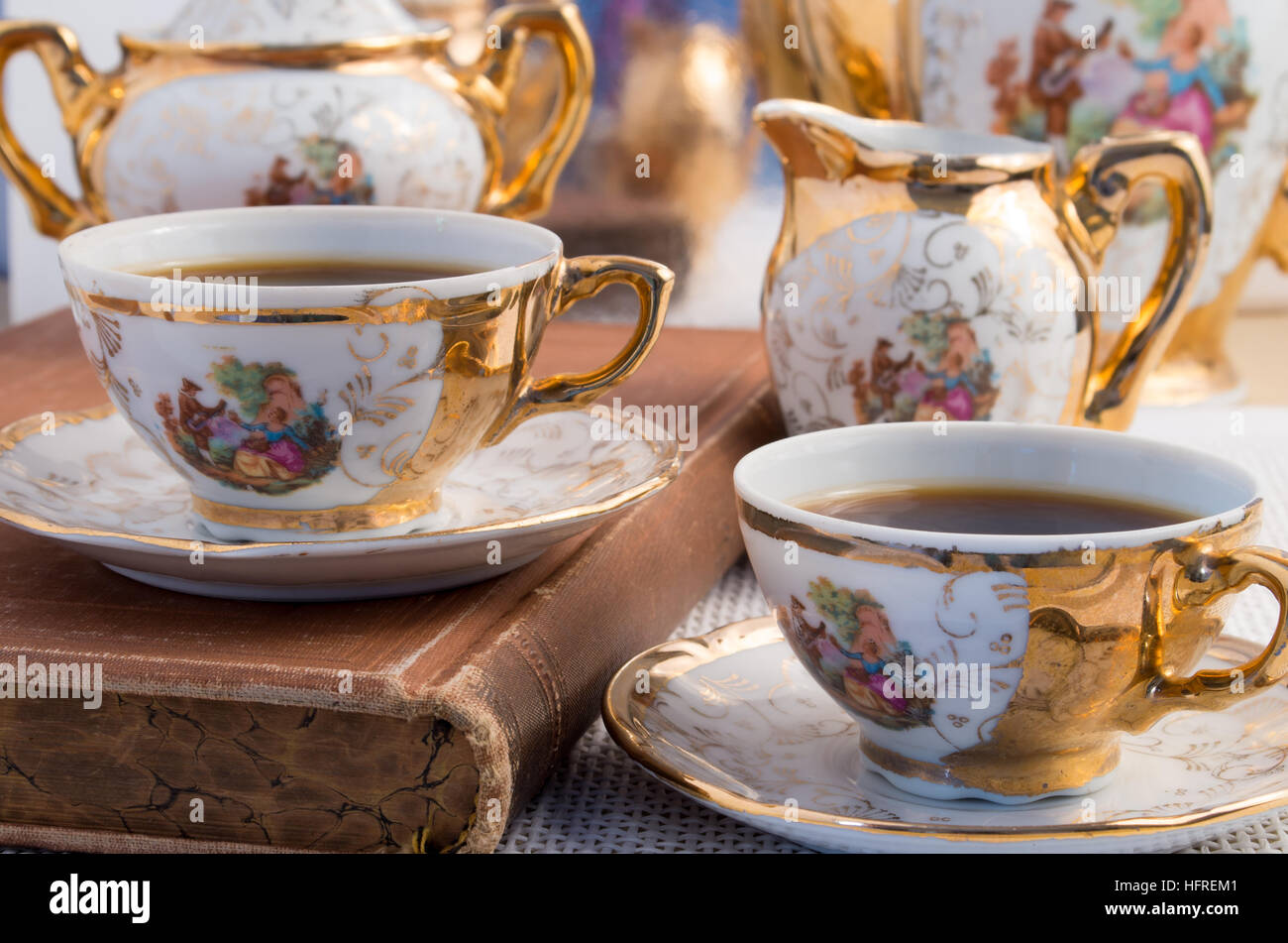 Vintage porcelain coffee cups with hot espresso and retro dishware from ...