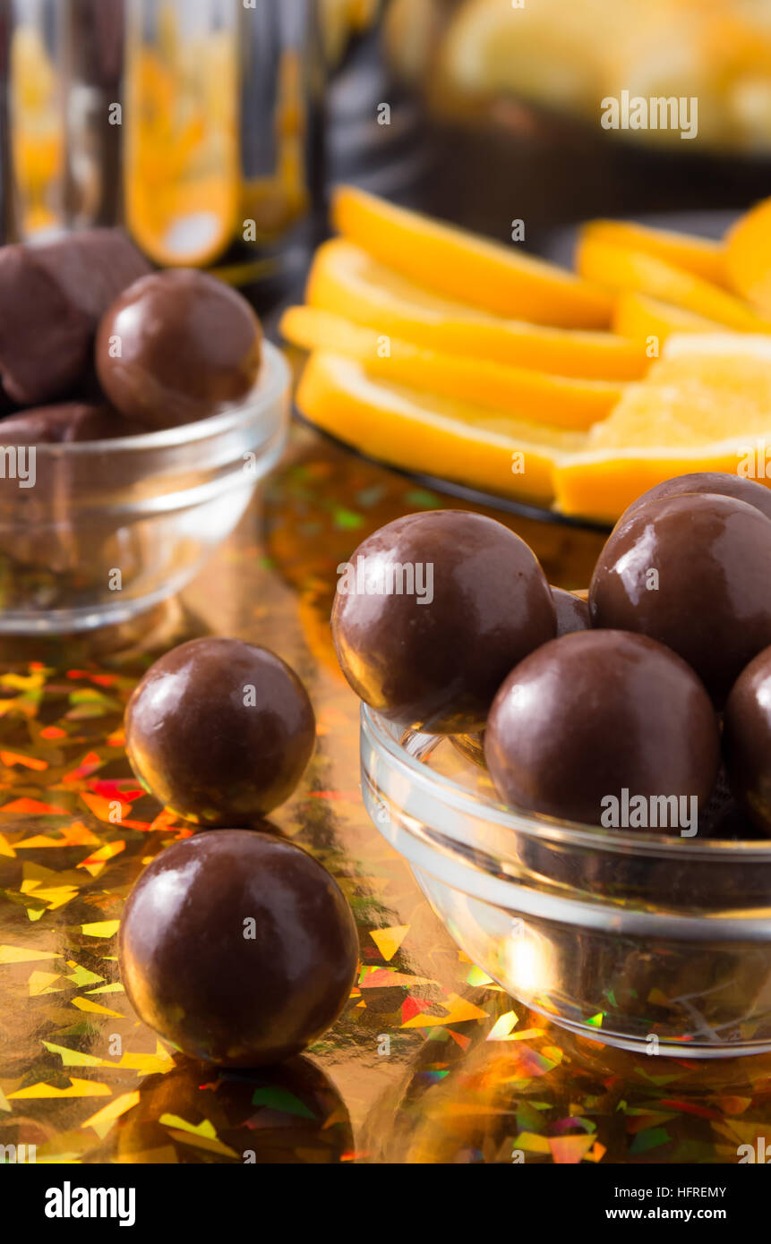 Round candy from chocolate close-up on a colorful background with blur ...