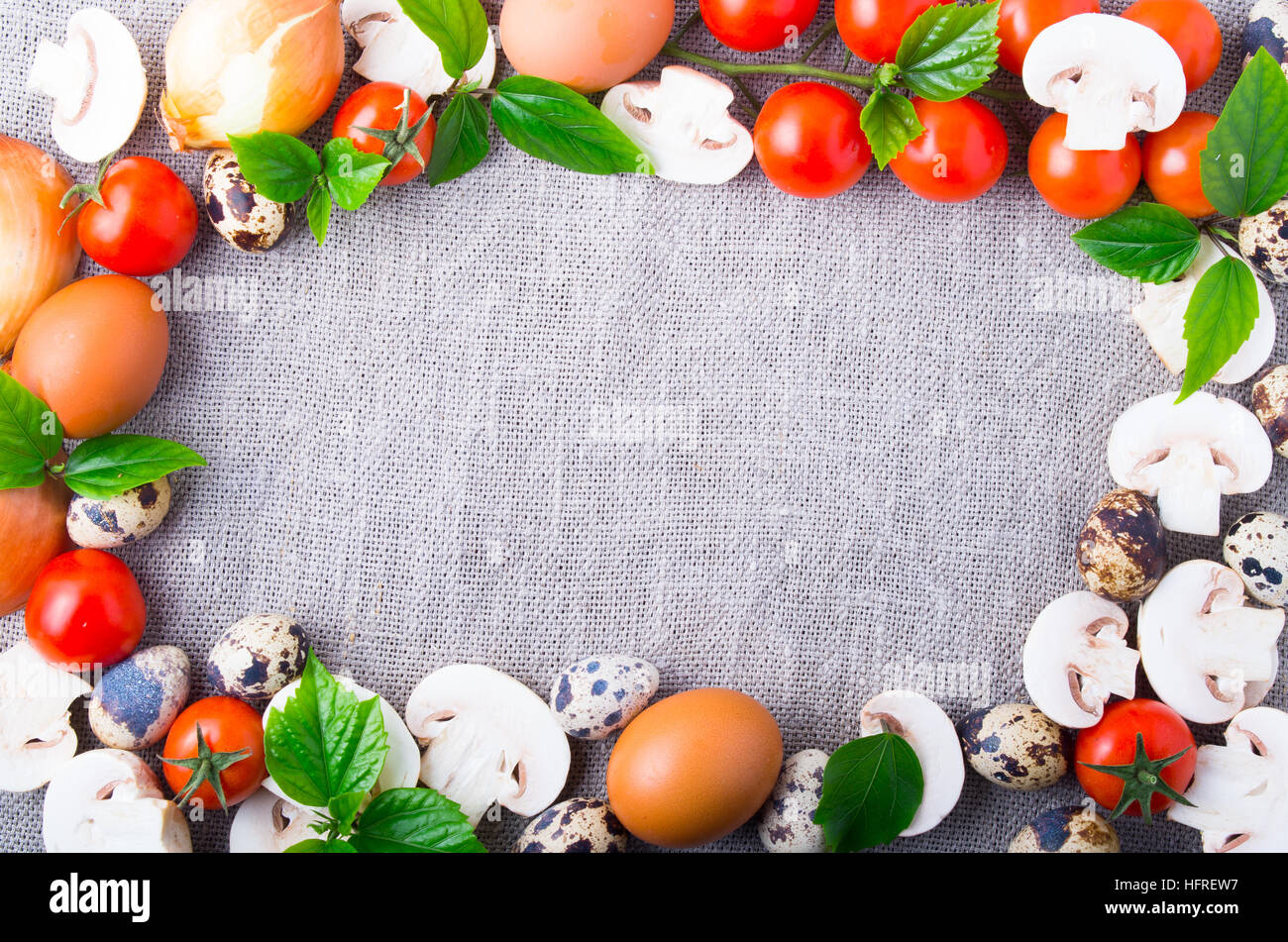 Top view of food ingredients for cooking as a frame on a table with a ...
