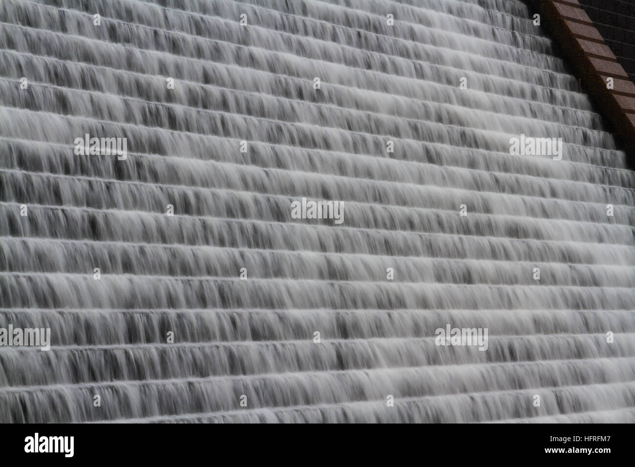Avon Dam with water flowing down making a background. Dartmoor, Devon ...