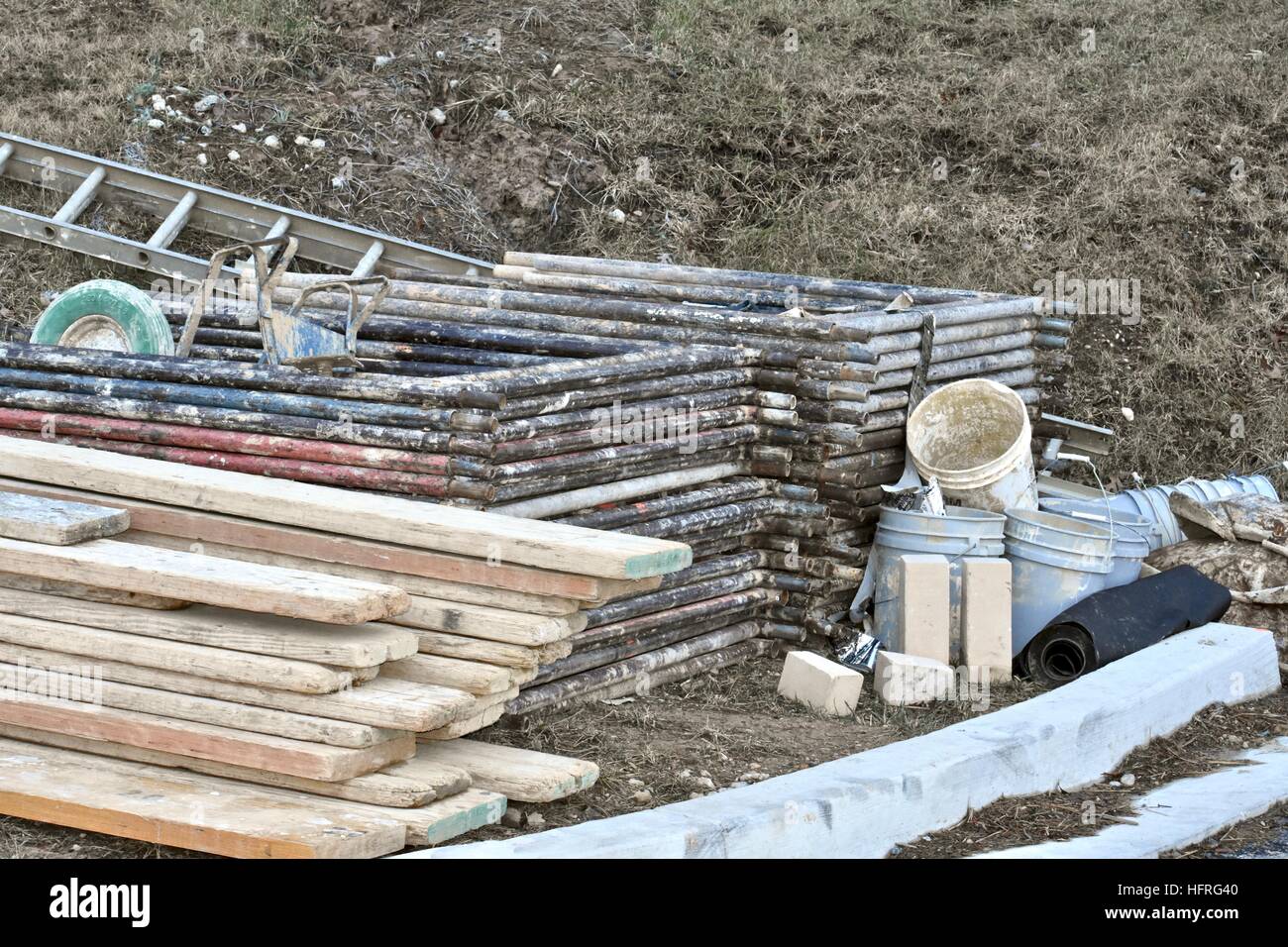 Construction equipment laying on the ground near a construction site ...